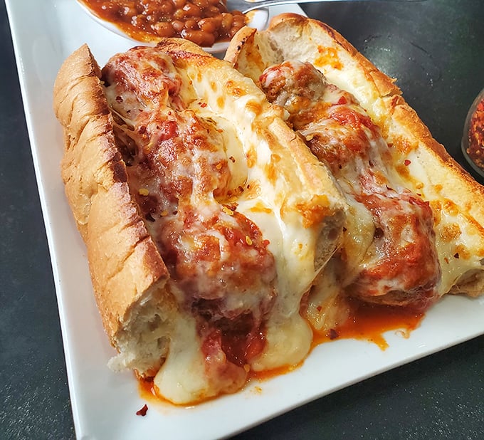 Behold the legendary meatball sub in all its saucy, cheesy glory. Those aren't just meatballs—they're edible works of art.
