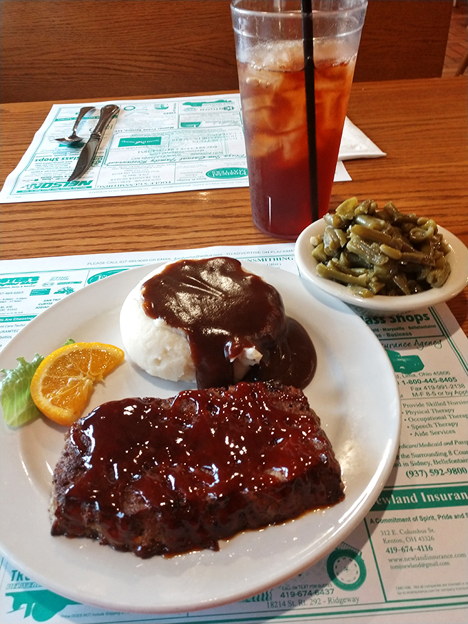 The legendary meatloaf arrives like a celebrity, glistening with tangy glaze and flanked by mashed potatoes. This isn't dinner—it's edible nostalgia.