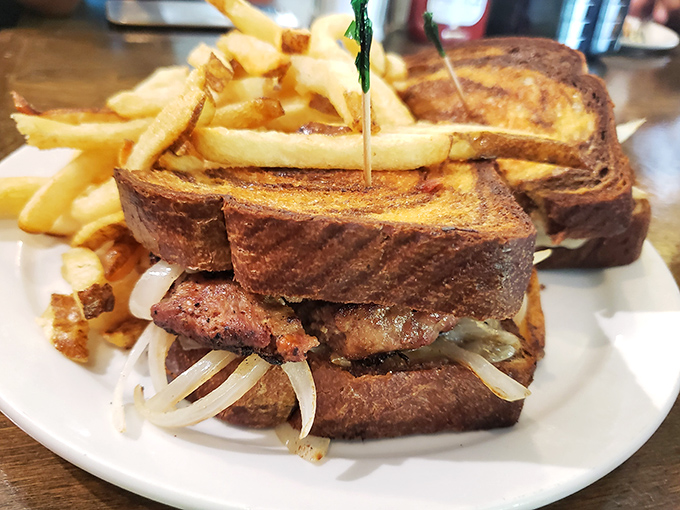 This melt isn't just grilled—it's been transformed into a tower of toasty perfection with fries that look hand-cut by angels.