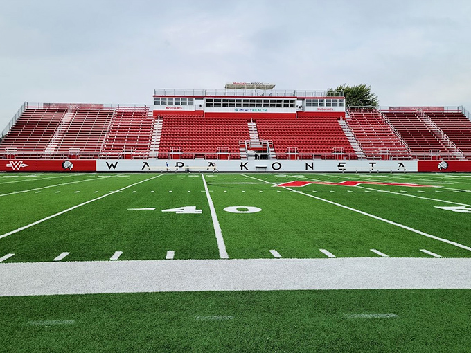 Friday night lights shine brightest at Wapakoneta's pristine stadium. The red seats await faithful fans who've been cheering on the Redskins for generations.