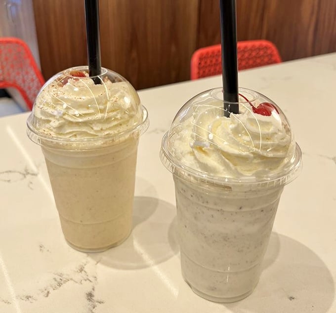 Two milkshakes, infinite possibilities. These cloud-topped beauties aren't just drinks—they're desserts with straws and a direct line to childhood joy.