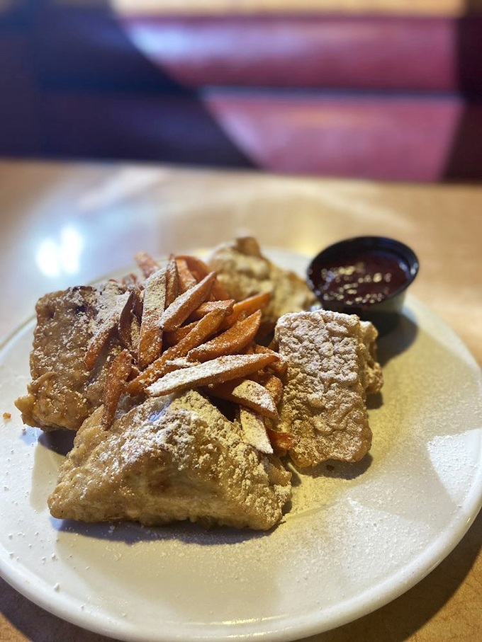 Golden-fried Monte Cristo perfection! Powdered sugar dusted triangles with sweet dipping sauce that makes your taste buds feel like they've won Best Supporting Actor.