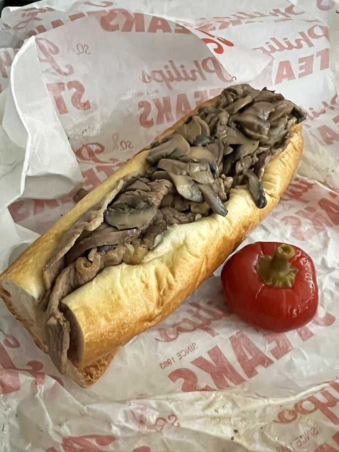 Behold the mushroom masterpiece in its natural habitat! Earthy fungi and tender beef nestled in a perfect roll, with a cherry pepper standing guard.