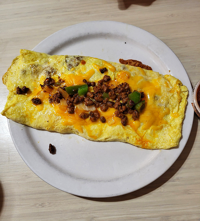 Behold the Mexican omelet – where chorizo, peppers and melted cheese create the kind of breakfast masterpiece that makes hitting snooze a criminal offense.