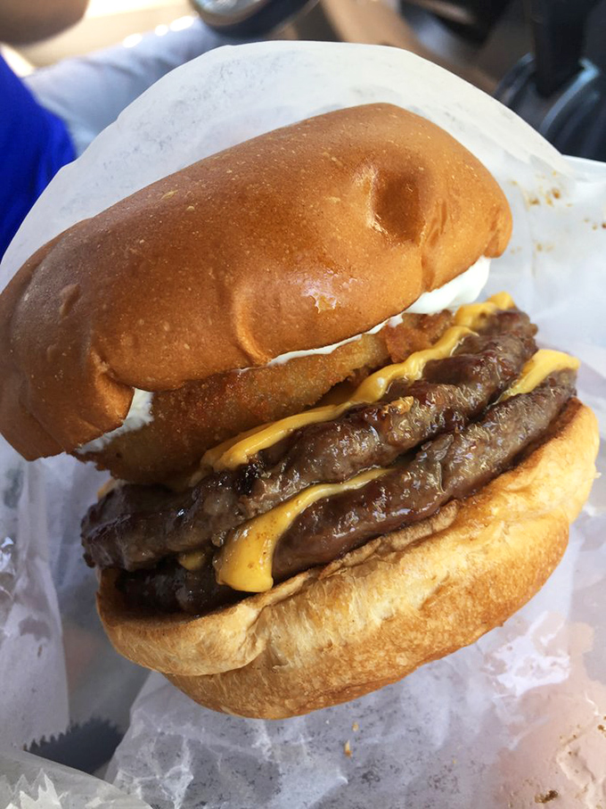 Behold the double-decker masterpiece – where juicy patties and melty cheese create the kind of burger that requires both hands and several napkins.
