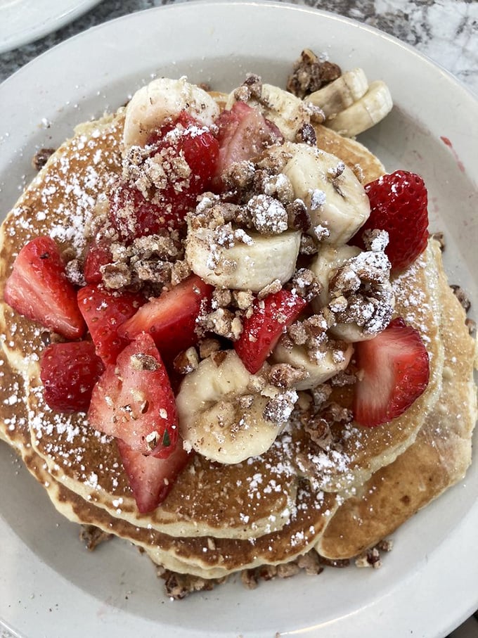 Pancake perfection topped with fresh fruit and a dusting of powdered sugar. Breakfast doesn't get more photogenic—or more heavenly—than this.