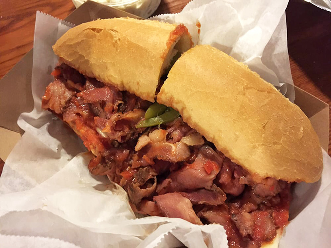 Behold the pastrami sandwich in all its glory! Tender meat piled high between crusty bread creates that perfect harmony that makes grown adults weep with joy.