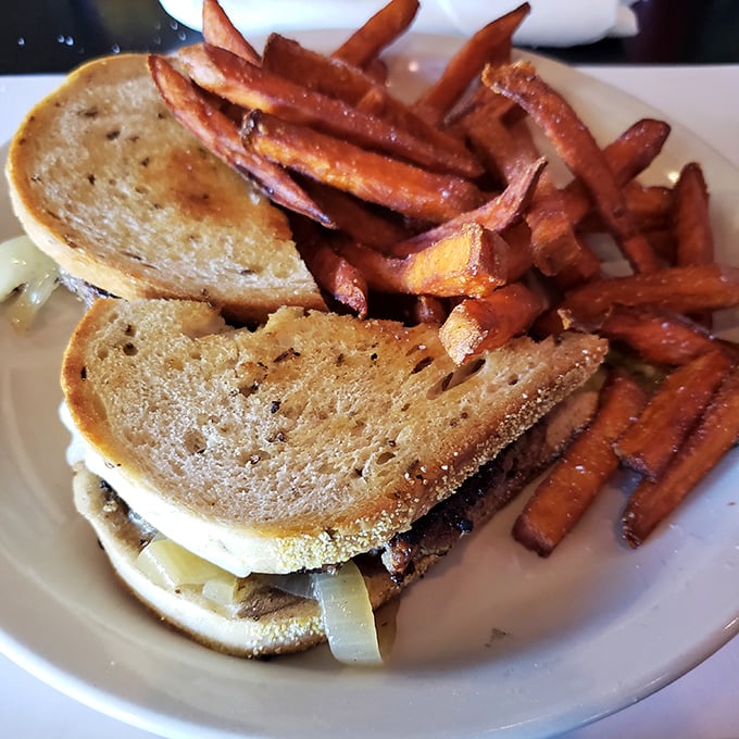 A proper patty melt should make you forget your table manners. This one, with its perfectly grilled bread and sweet potato fries, certainly does the trick.