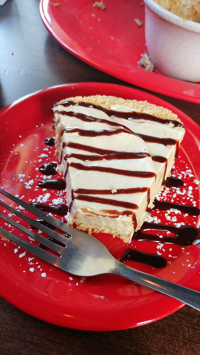 This peanut butter pie isn't just dessert—it's a religious experience. The chocolate drizzle is just showing off at this point.