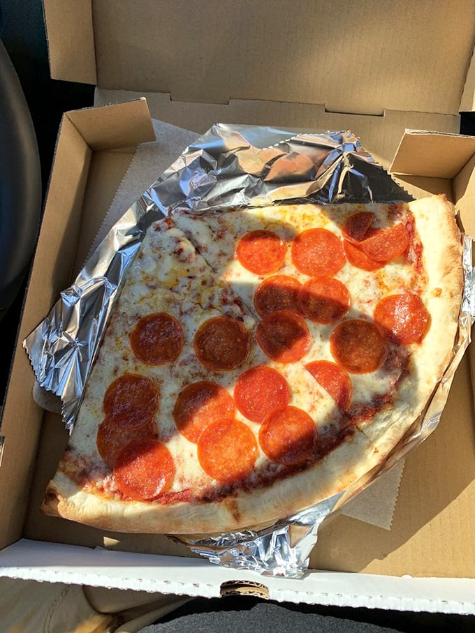 Behold the star attraction: pepperoni that curls into perfect little cups, creating flavor reservoirs that pizza aficionados dream about. Worth every mile of the journey.
