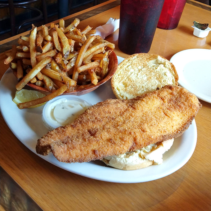 The legendary Lake Erie perch sandwich in all its golden-fried glory. This isn't just lunch—it's the reason people drive across state lines.