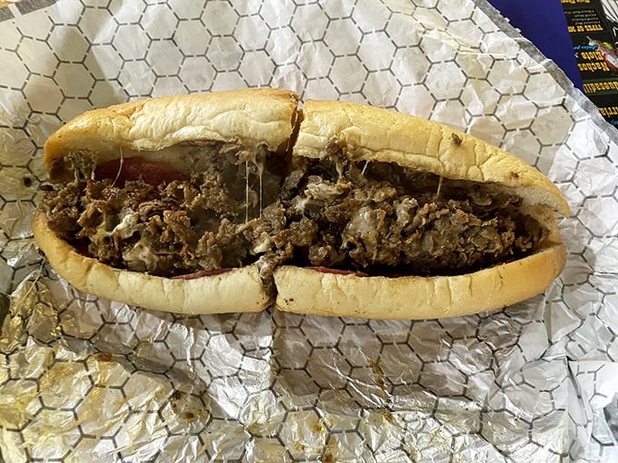 Behold the star of the show—thinly sliced ribeye, perfectly chopped, with cheese melted throughout. Poetry on a roll, Philadelphia-style.