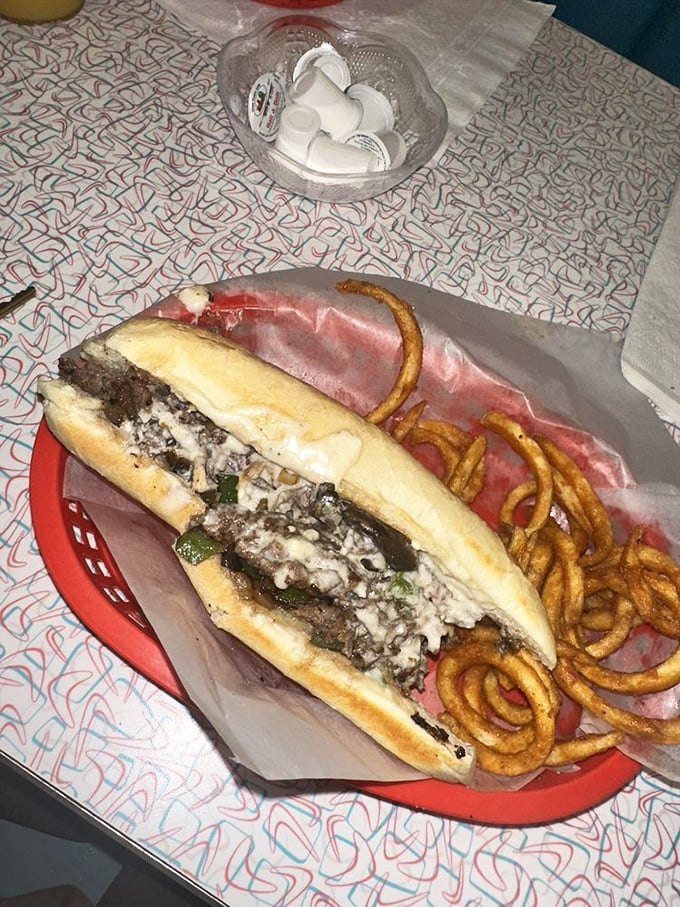 Behold the star of the show—a Philly cheese steak that would make Philadelphia nervous. Those perfectly caramelized onions and peppers nestled against melty cheese deserve their own fan club.