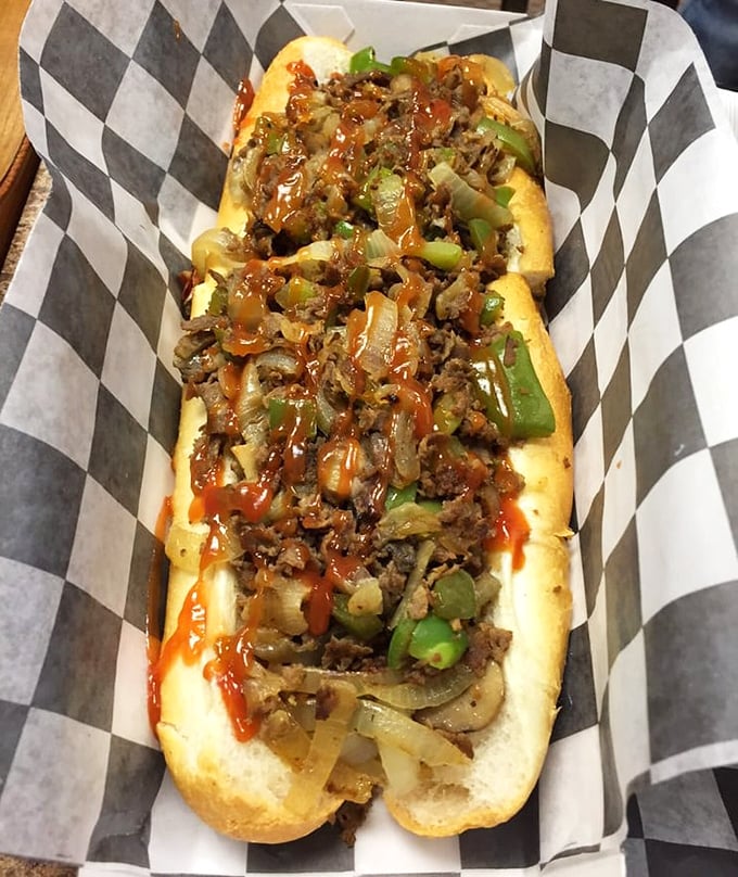 Behold the halal cheesesteak in its natural habitat—tender ribeye, melted cheese, and perfectly caramelized onions nestled in a just-right roll.