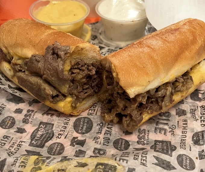 Behold the holy grail of Philadelphia cuisine – thinly sliced ribeye and melted cheese cradled in a perfect roll. Poetry in sandwich form.