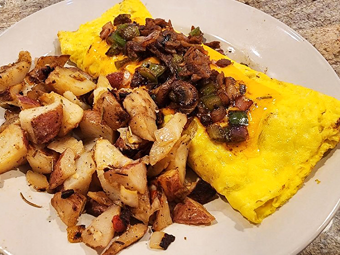 This isn't just an omelet—it's a golden envelope delivering a message of bacon, vegetables, and potato perfection.