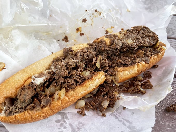 Meat poetry on a roll. This isn't just a sandwich—it's a perfectly choreographed dance of thinly sliced beef, melted cheese, and bread that deserves a standing ovation.
