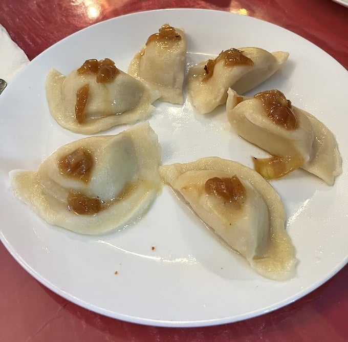 Golden-brown pierogies glisten with butter and caramelized onions. These aren't just dumplings—they're edible hugs from Eastern Europe.