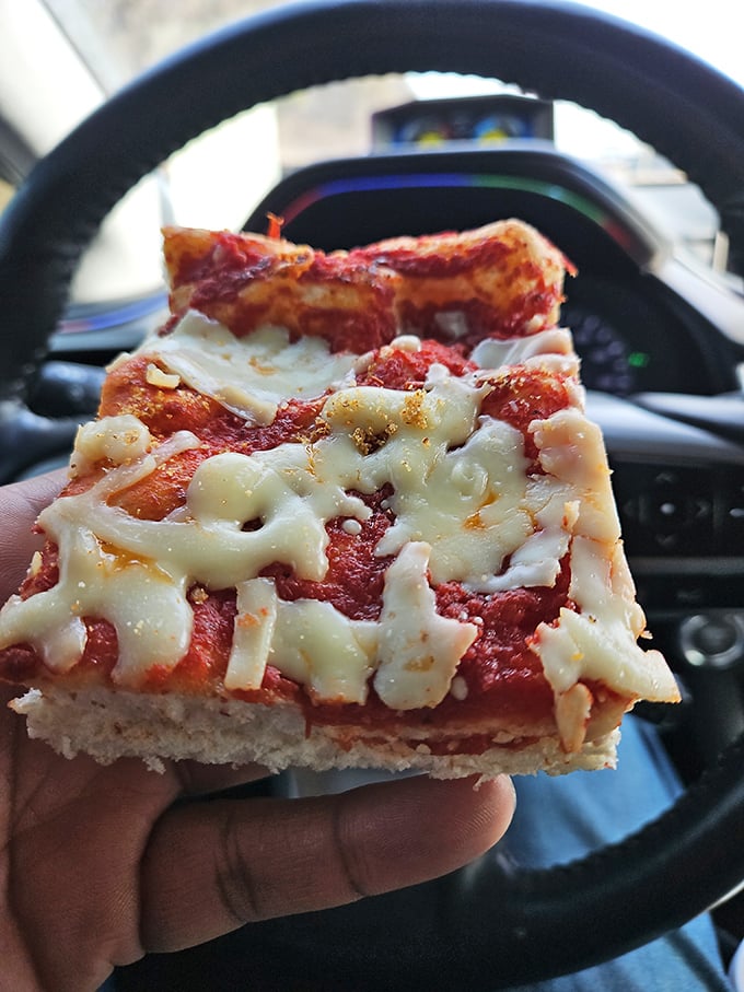 The legendary pizza that launched a thousand road trips – thick, cheesy, and eaten in the car because waiting until home is simply not an option.