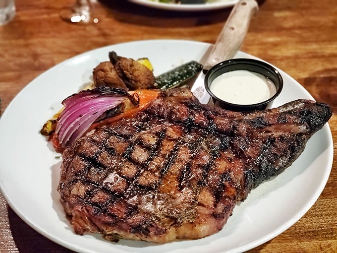 This isn't just a steak; it's a masterclass in meat preparation. Those perfect grill marks aren't just for show—they're flavor geography you can taste.