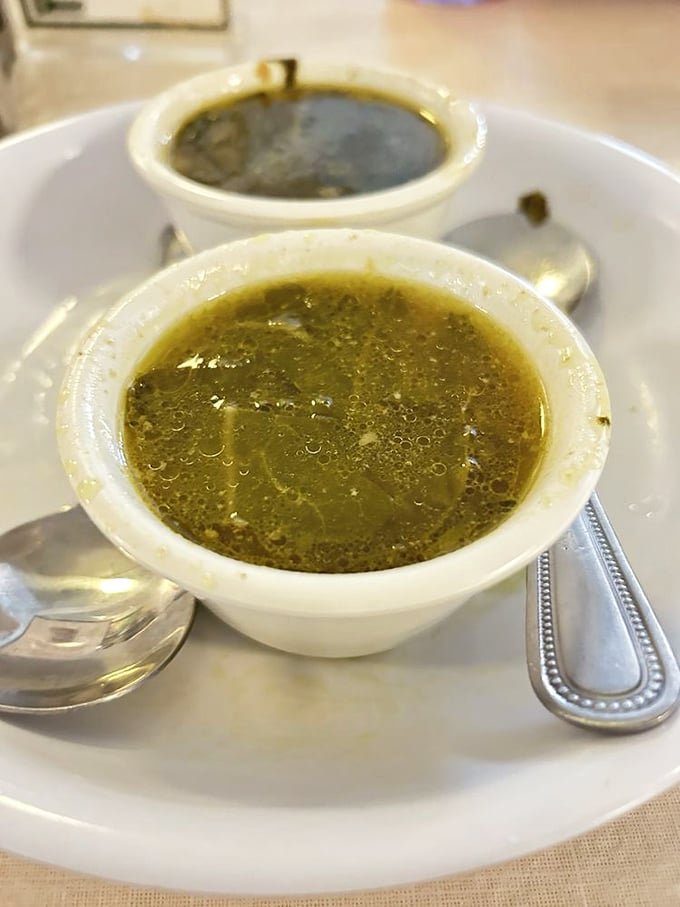 Pot likker—that magical elixir born from collard greens—sits ready to baptize your taste buds into the church of Southern cooking.