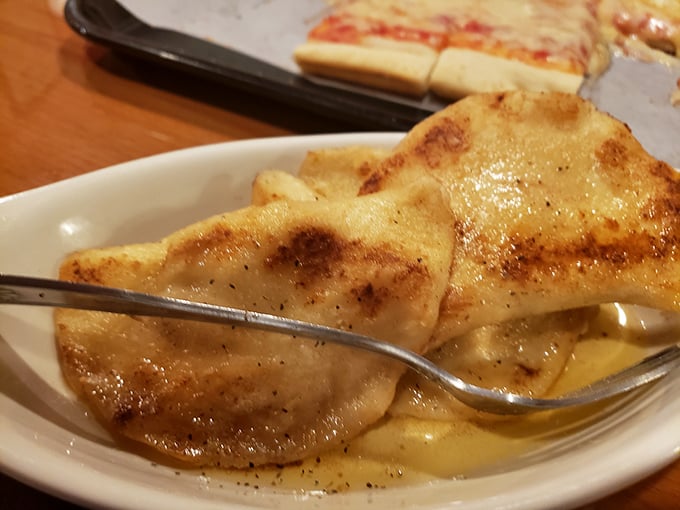 Golden-brown pierogies that would make your grandmother weep with joy—crispy exterior giving way to potato perfection that's worth every single calorie.