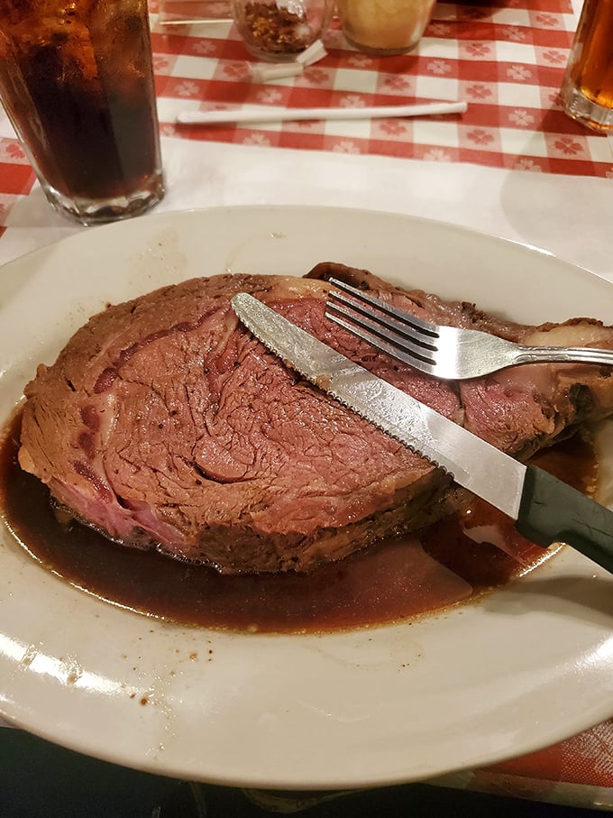 Behold the star of the show – a prime rib so perfectly executed it makes you wonder why anyone bothers with fancy food trends. This is meat at its most magnificent.