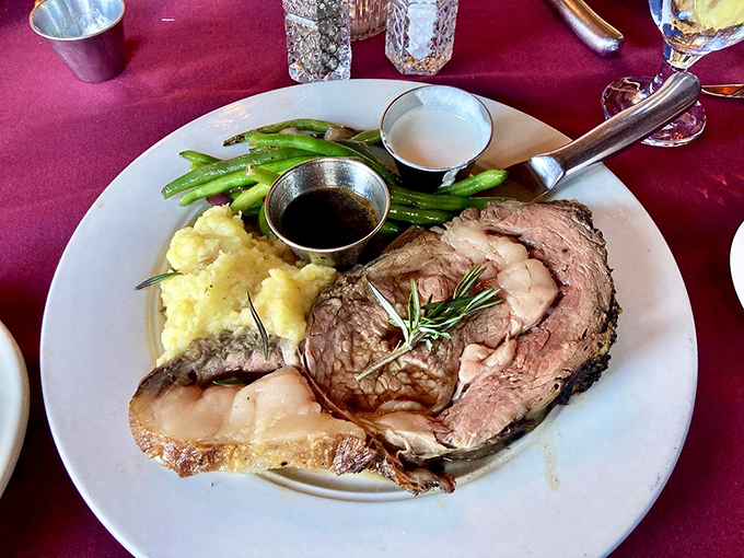 Behold the prime rib that launched a thousand return visits – perfectly crusted, impossibly tender, absolutely unforgettable.