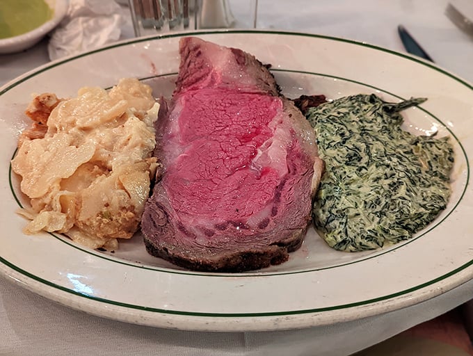 Behold the holy trinity of steakhouse perfection: tender prime rib, creamy spinach, and crispy potatoes that dreams are made of.