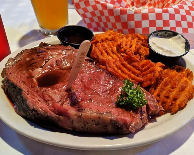 This prime rib isn't just cooked—it's been coaxed to perfection, with sweet potato fries that could start their own fan club.