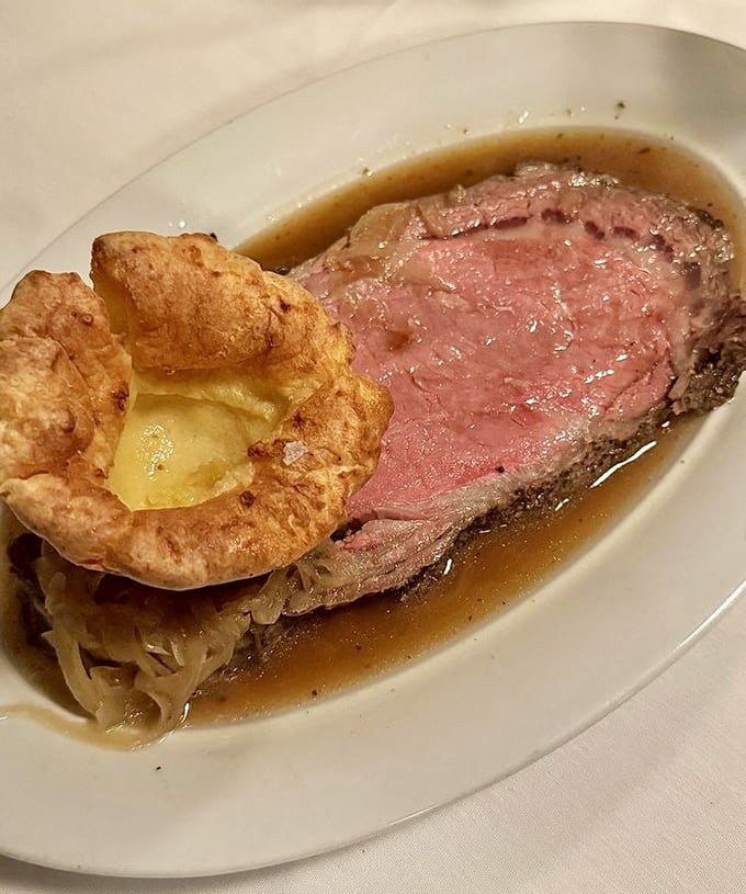 Prime rib perfection that makes time stand still – a rosy center surrounded by savory jus and a Yorkshire pudding that defies gravity.