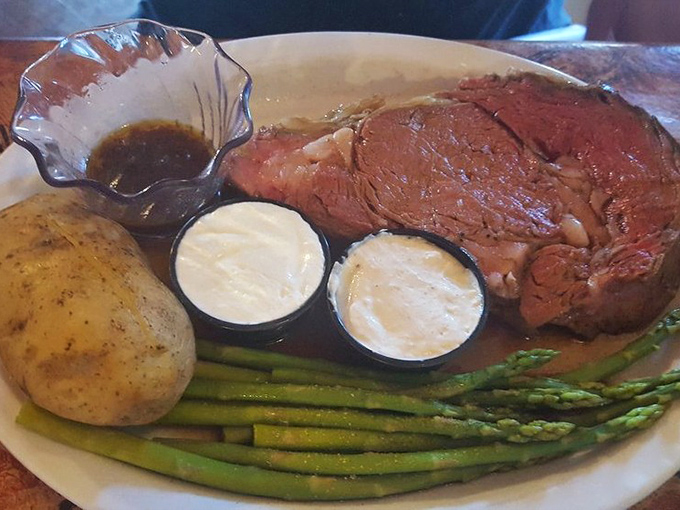 Prime rib that doesn't just melt in your mouth—it throws a party there. Those asparagus spears aren't just sides; they're the perfect supporting cast.