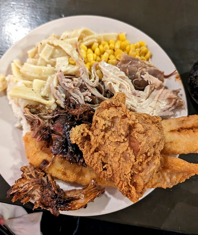 The ultimate sampler plate—tender pulled pork, crispy fried chicken, and homestyle sides that make decision-making the hardest part of your meal.