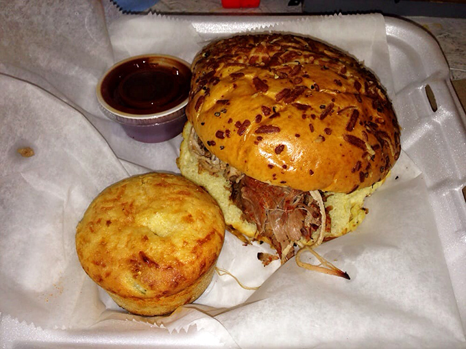 A pulled pork sandwich that doesn't just speak to you—it serenades. That golden cornbread muffin is the perfect backup singer.