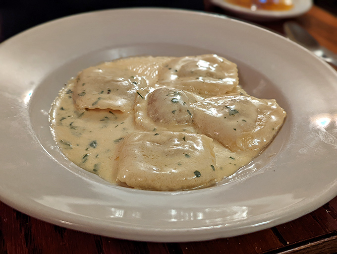 Pillowy ravioli swimming in a silky cream sauce—this isn't just dinner, it's a religious experience that demands a moment of respectful silence.