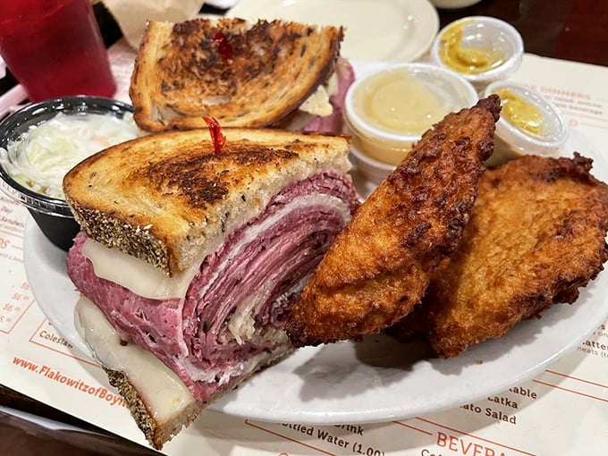 The Reuben arrives like a skyscraper of flavor—corned beef stacked so high you'll need a game plan just to take the first bite.