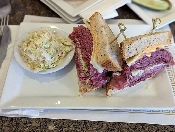 The Reuben at 3G's doesn't just satisfy hunger—it resolves existential crises. That perfect ratio of corned beef, sauerkraut, and Russian dressing is poetry.
