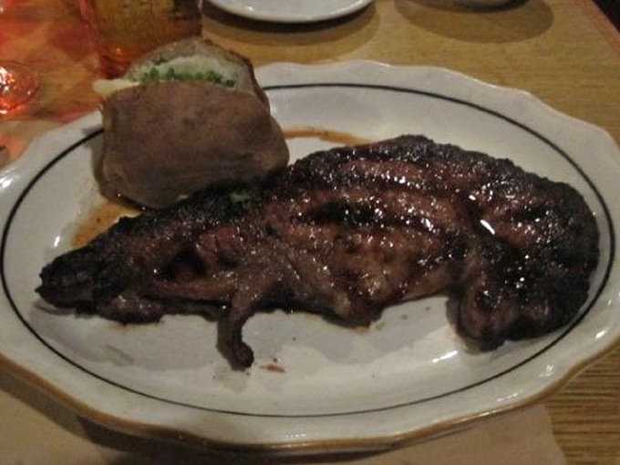 This rib steak isn't just cooked—it's been transformed through some mystical combination of fire, timing, and respect for good beef. The baked potato is just along for the glorious ride.
