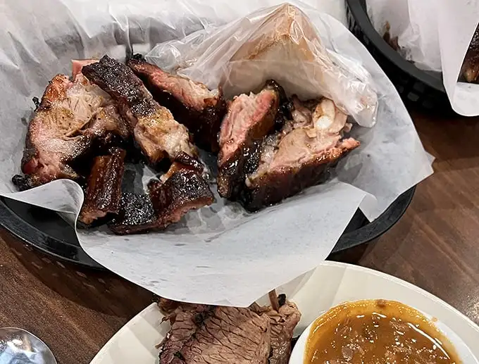 These rib tips aren't just cooked, they're conducted – a perfect harmony of smoke, spice, and that beautiful bark that makes barbecue lovers weak in the knees.