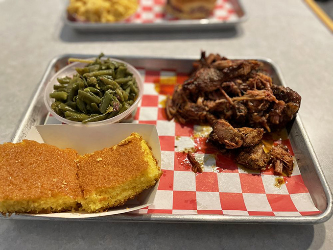 Rib tips that make you question every other barbecue experience you've ever had. That cornbread and those green beans aren't just sides – they're supporting actors deserving their own award.