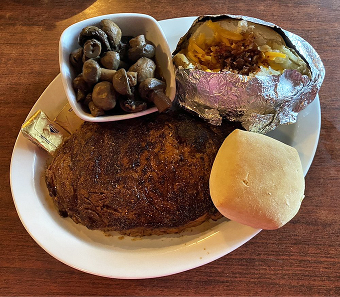 This isn't just a steak; it's a declaration of independence from mediocre meals. The loaded baked potato and sautéed mushrooms are worthy sidekicks.