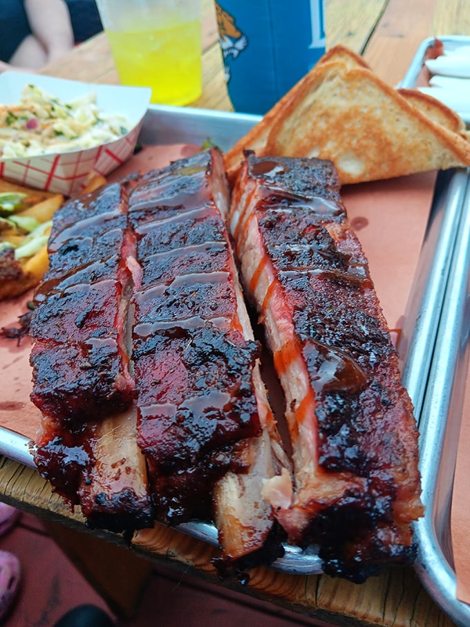 These ribs don't just fall off the bone—they practically leap into your mouth, trailing a wake of smoky perfection.