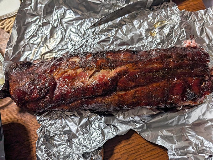 These ribs aren't just falling off the bone—they're practically writing poetry about their 14-hour smoke bath.