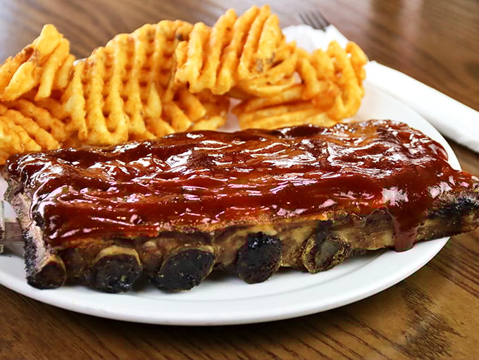 These ribs don't just fall off the bone—they practically leap into your mouth, glazed with a sauce worth every napkin you'll need.