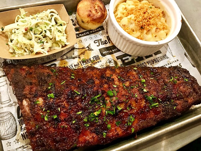 Behold, the rack of ribs that launched a thousand return visits. That bark, that glaze, that perfect chive garnish—barbecue nirvana achieved.