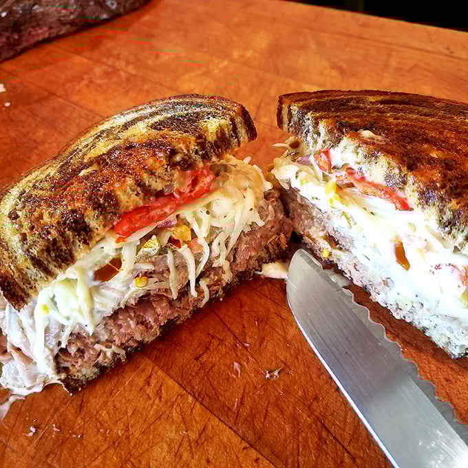 Behold the sandwich equivalent of a symphony – layers of perfectly carved meat, melted cheese, and toasted bread in harmonious balance.