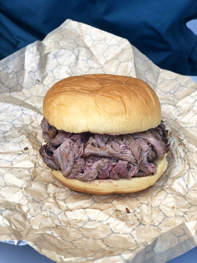 Behold the star of the show: thinly sliced pit beef piled high on a kaiser roll, pink in the middle like nature intended.