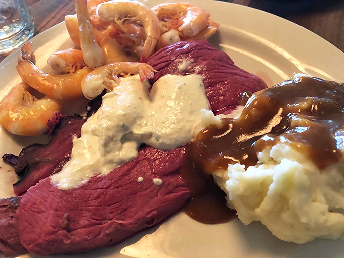 Tender roast beef, plump shrimp, and cloud-like mashed potatoes—the holy trinity of comfort food that makes diets weep and taste buds rejoice.