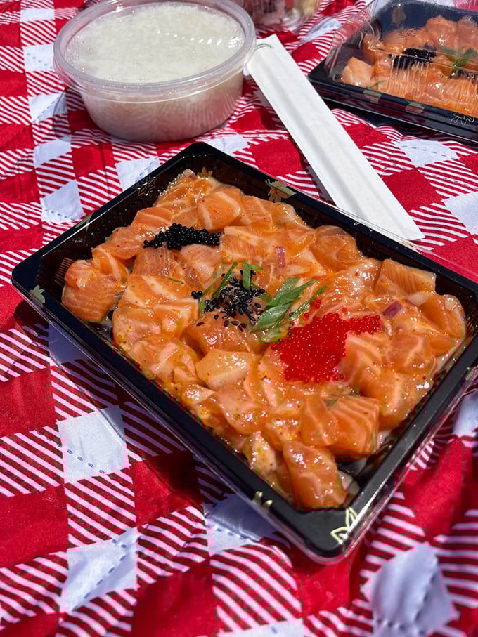 This salmon poke is the aquatic equivalent of a sunset – vibrant orange cubes glistening with marinade, topped with tobiko that pops like tiny flavor fireworks.
