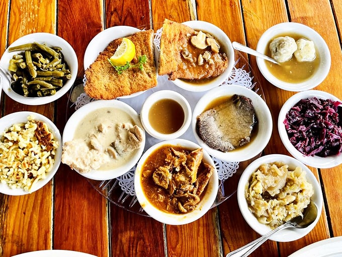 Food paradise found! This German sampler platter offers a United Nations of flavors—crispy schnitzel, savory sides, and those dumplings that could make a grown man weep with joy.